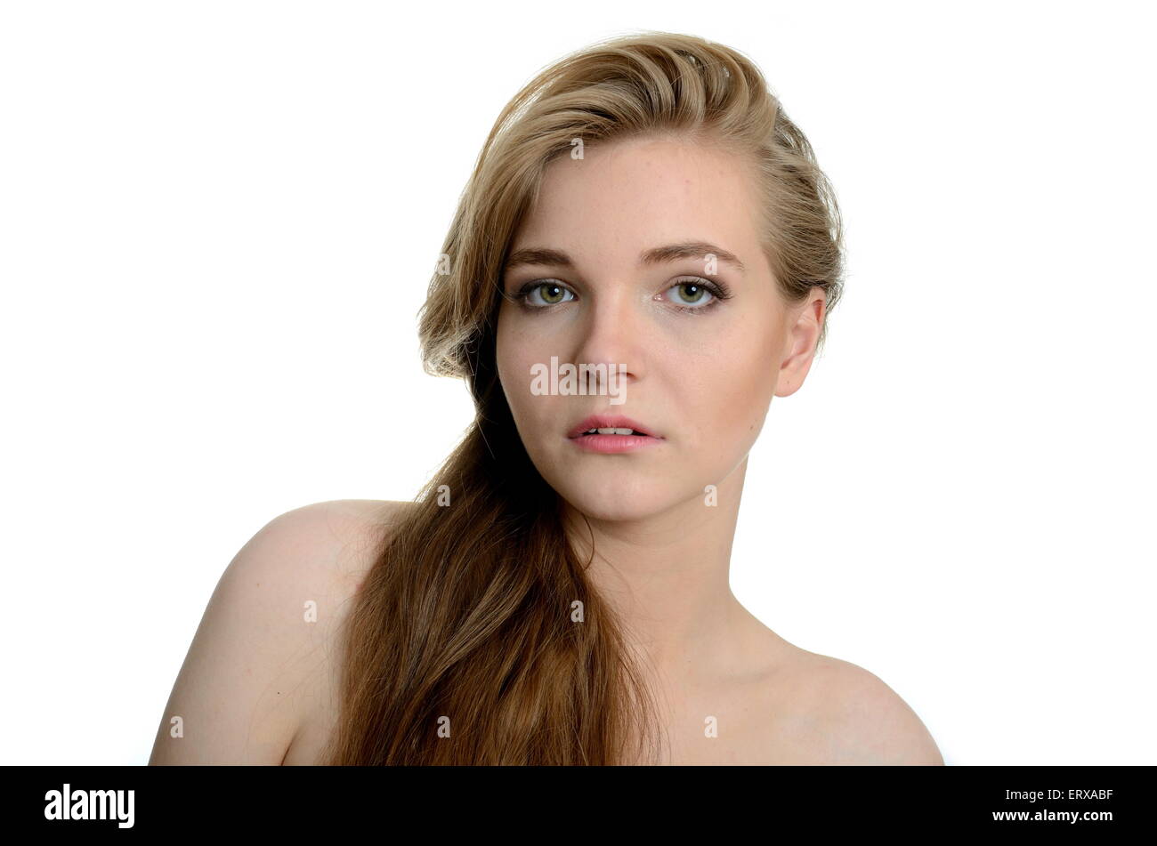 Young girl with kind and soft face expression. Portrait of female model ...