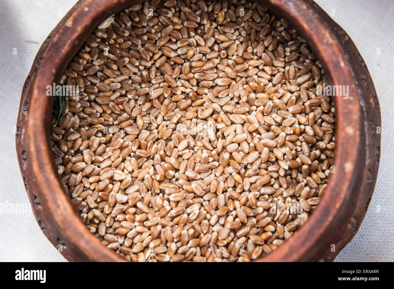 Clay pot with a wheat grain on a table as seen from above Stock Photo ...