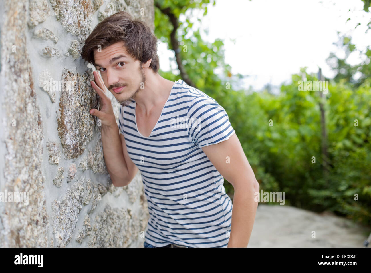 young casual silly man posing, smiling at the camera, outdoors Stock ...