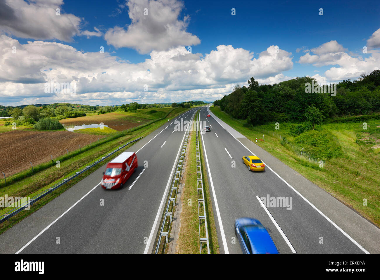 Highway traffic with beautiful clouds Stock Photo - Alamy