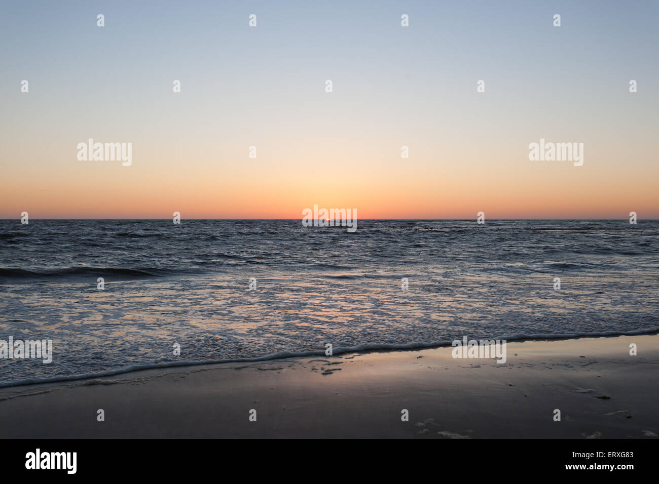 Namibian sunset at Swakopmund beach Stock Photo - Alamy