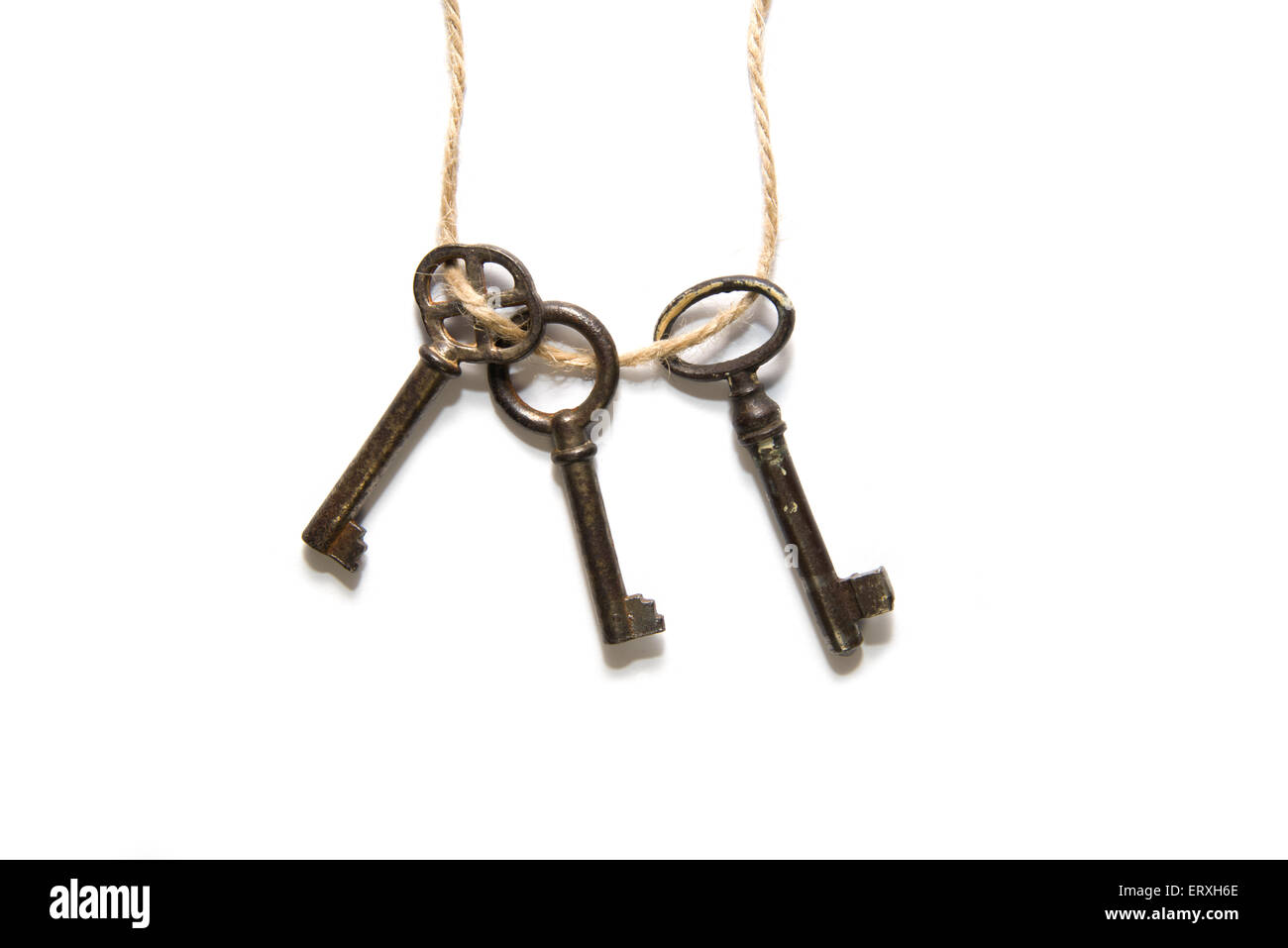 Three very old keys tied with a rope on a white background Stock Photo ...