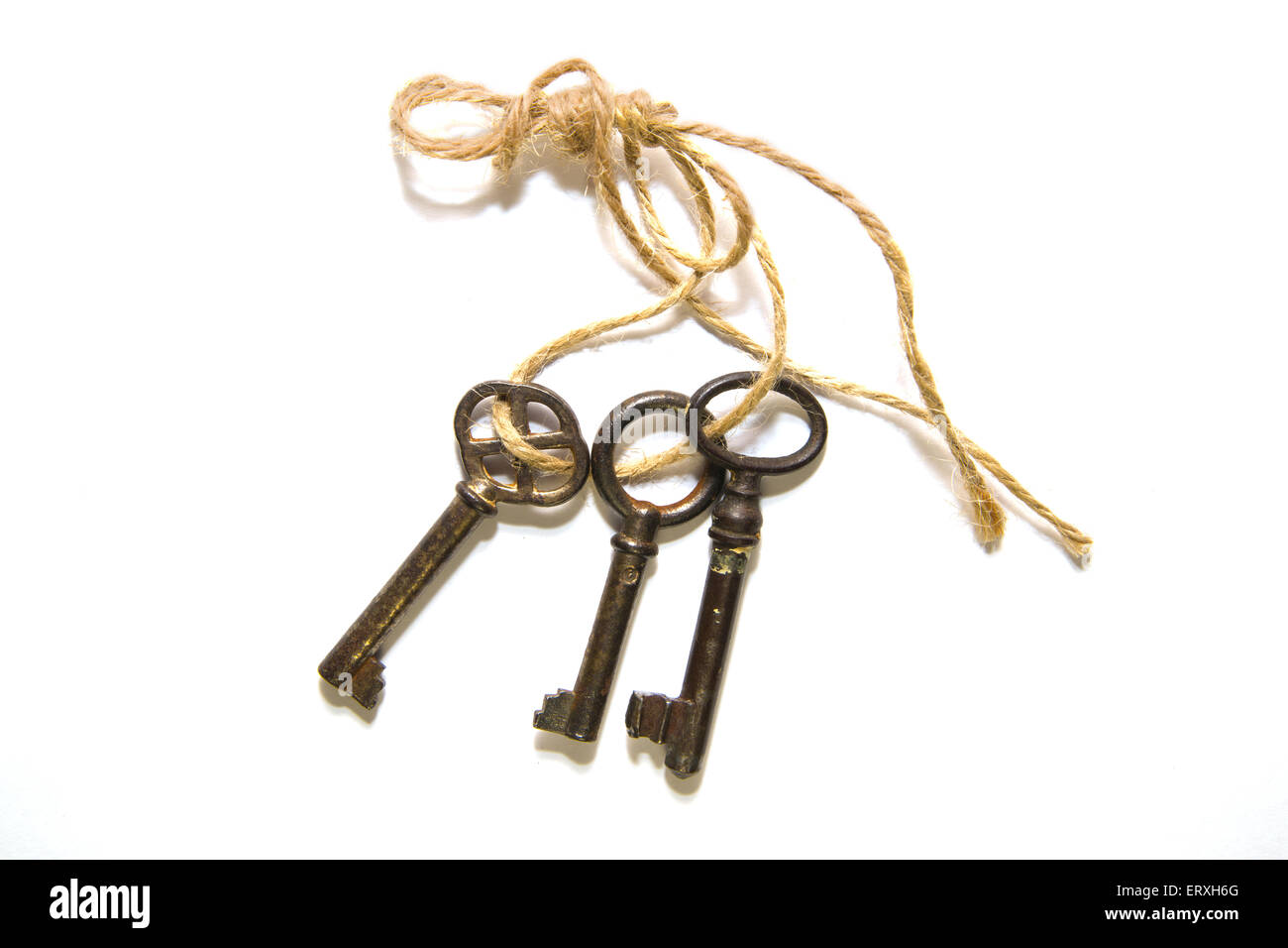 Three very old keys tied with a rope on a white background Stock Photo ...