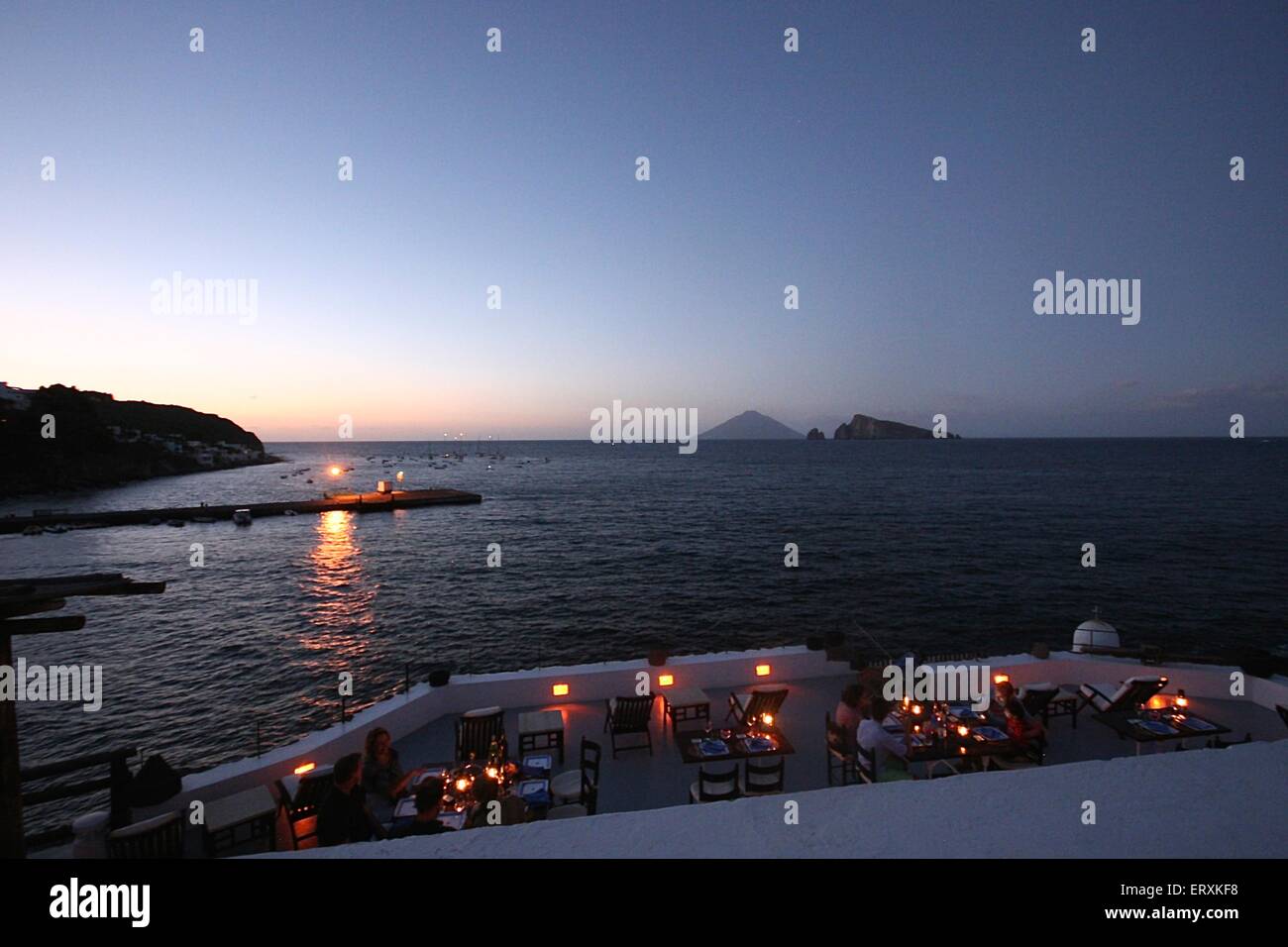 Sunset at Panarea and looking over to Stromboli island Stock Photo - Alamy