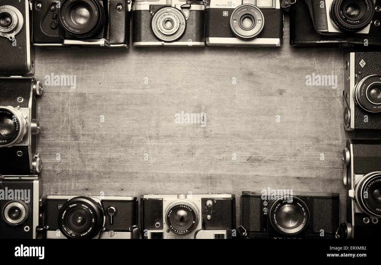 Old retro film analogue cameras collection on vintage wooden desk ...