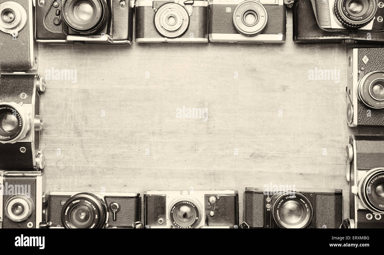 Old retro film analogue cameras collection on vintage wooden desk ...