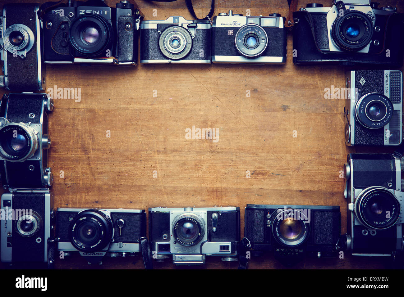 Old retro film analogue cameras collection on vintage wooden desk ...