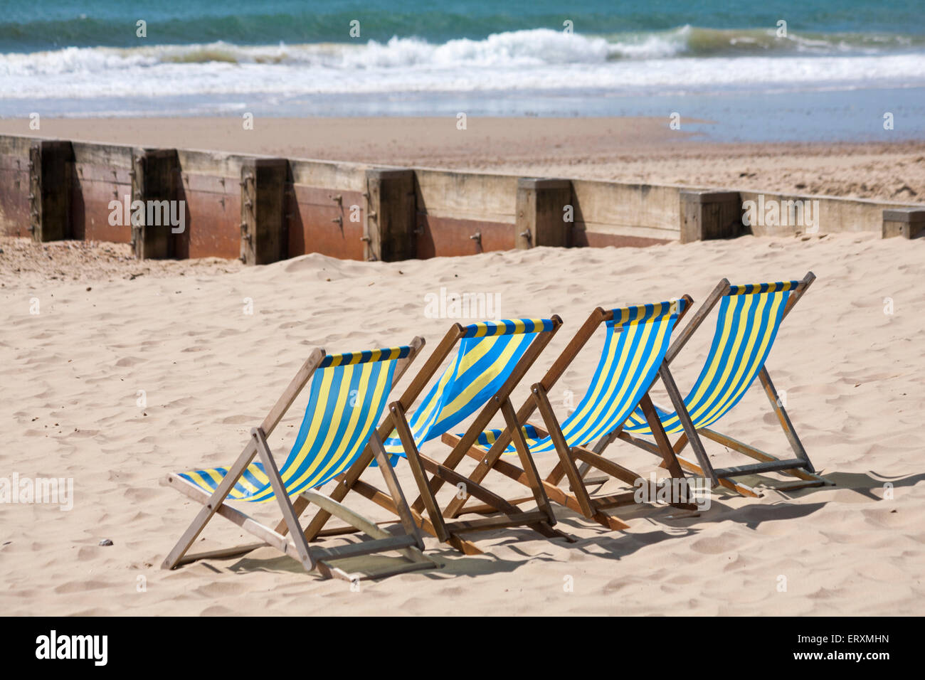 Empty deckchairs and groyne at Bournemouth beach in June Stock Photo ...