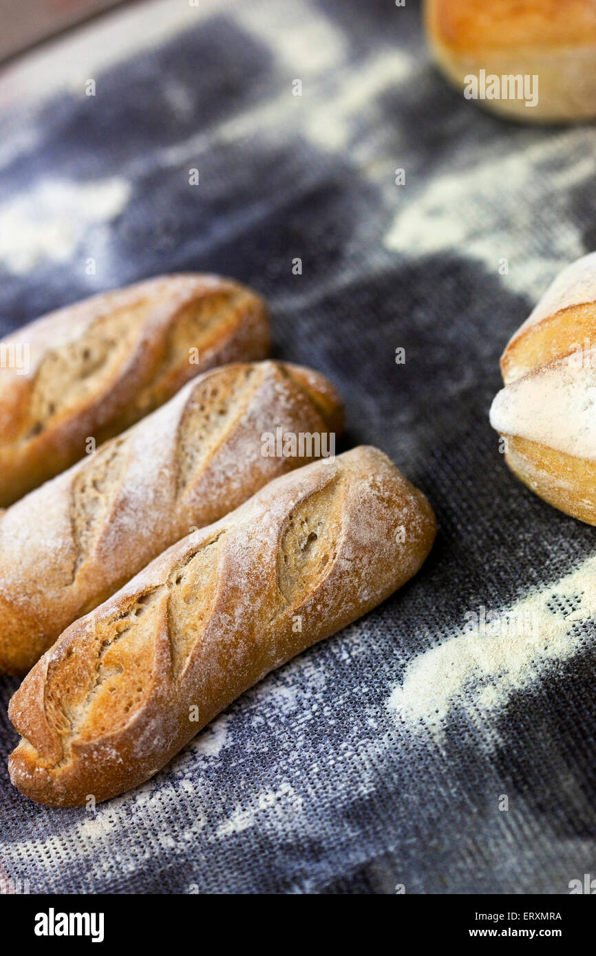 Small breads and flour in a French bakery Stock Photo - Alamy