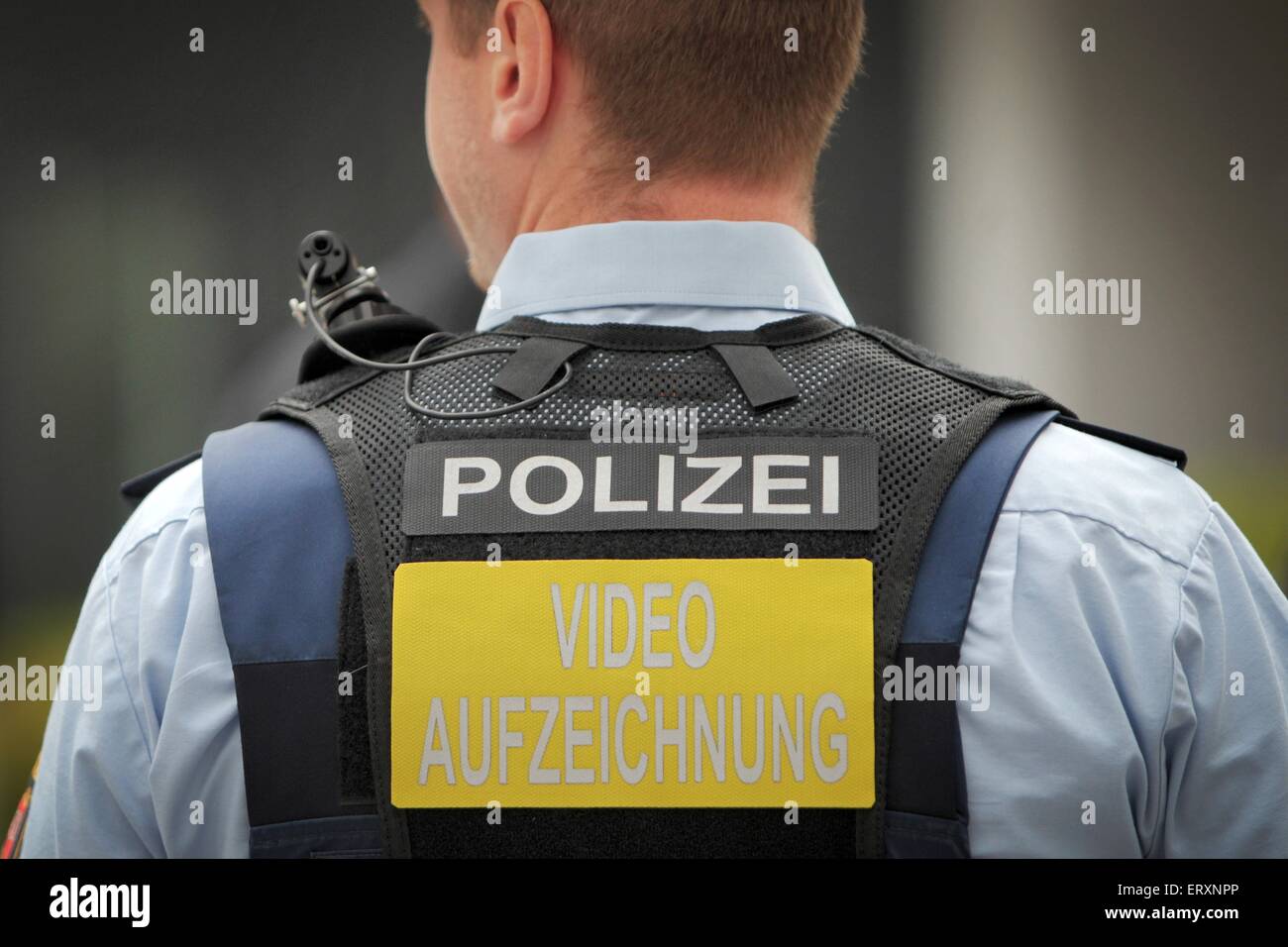 Mainz, Germany. 08th June, 2015. A German police officer has a small ...