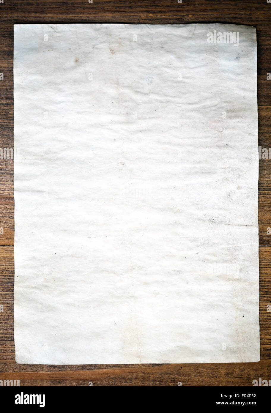 old paper on wooden background Stock Photo - Alamy