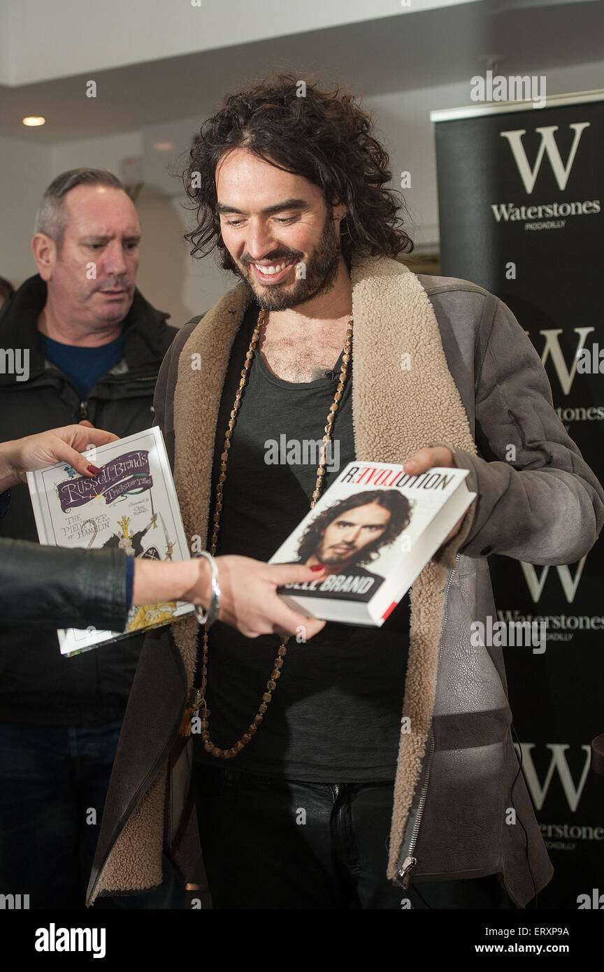 Russell Brand signs copies of his new books 'Revolution' and 'The Pied ...