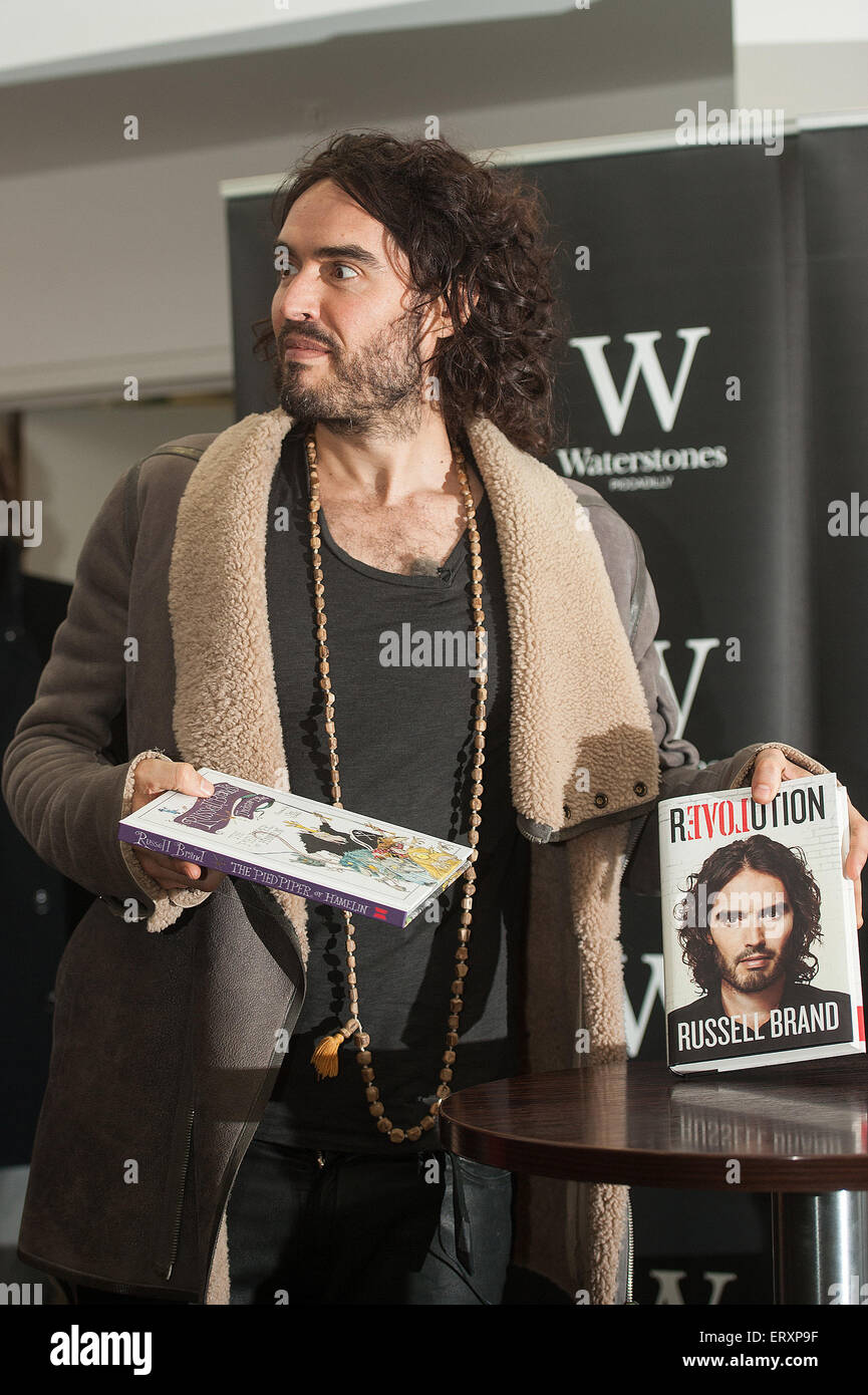 Russell Brand signs copies of his new books 'Revolution' and 'The Pied ...