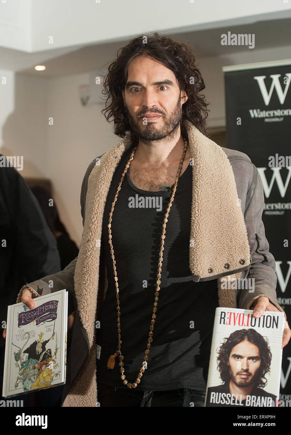 Russell Brand signs copies of his new books 'Revolution' and 'The Pied ...