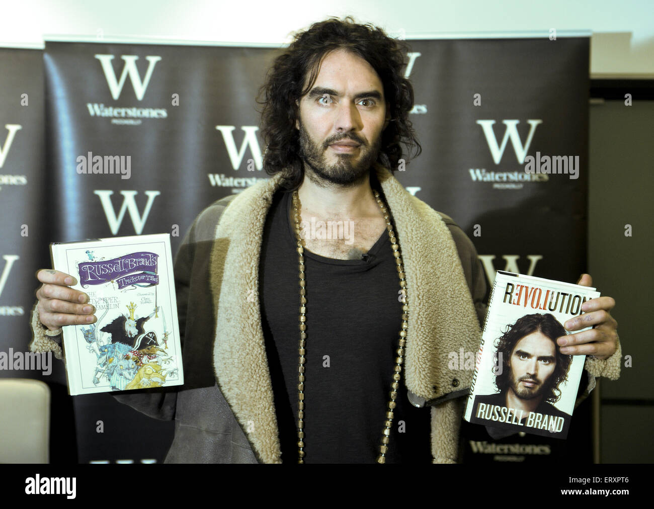 Russell Brand signs copies of his new books 'Revolution' and 'The Pied ...
