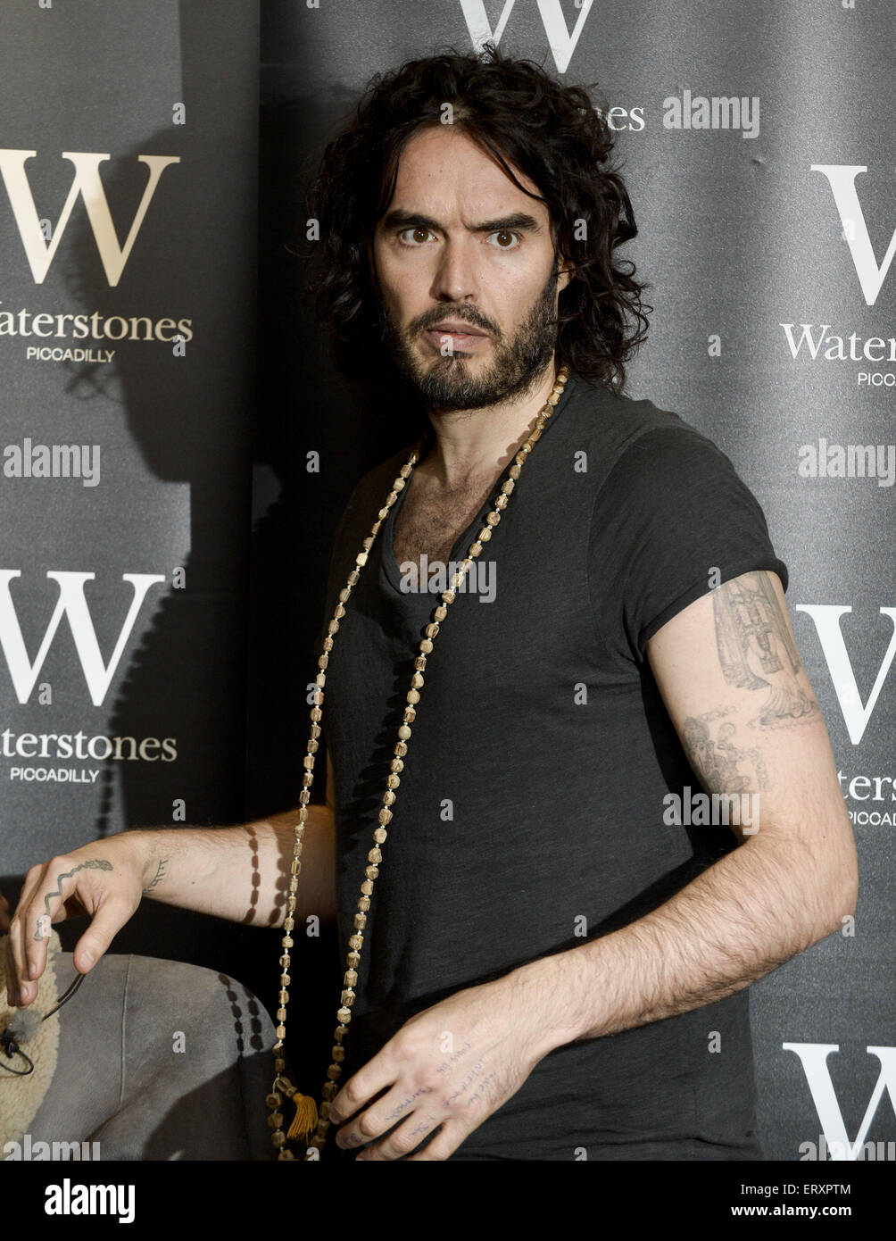 Russell Brand signs copies of his new books 'Revolution' and 'The Pied ...