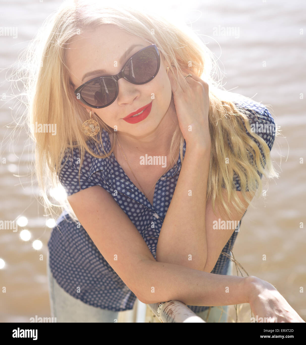 young beautiful woman in sun light Stock Photo - Alamy