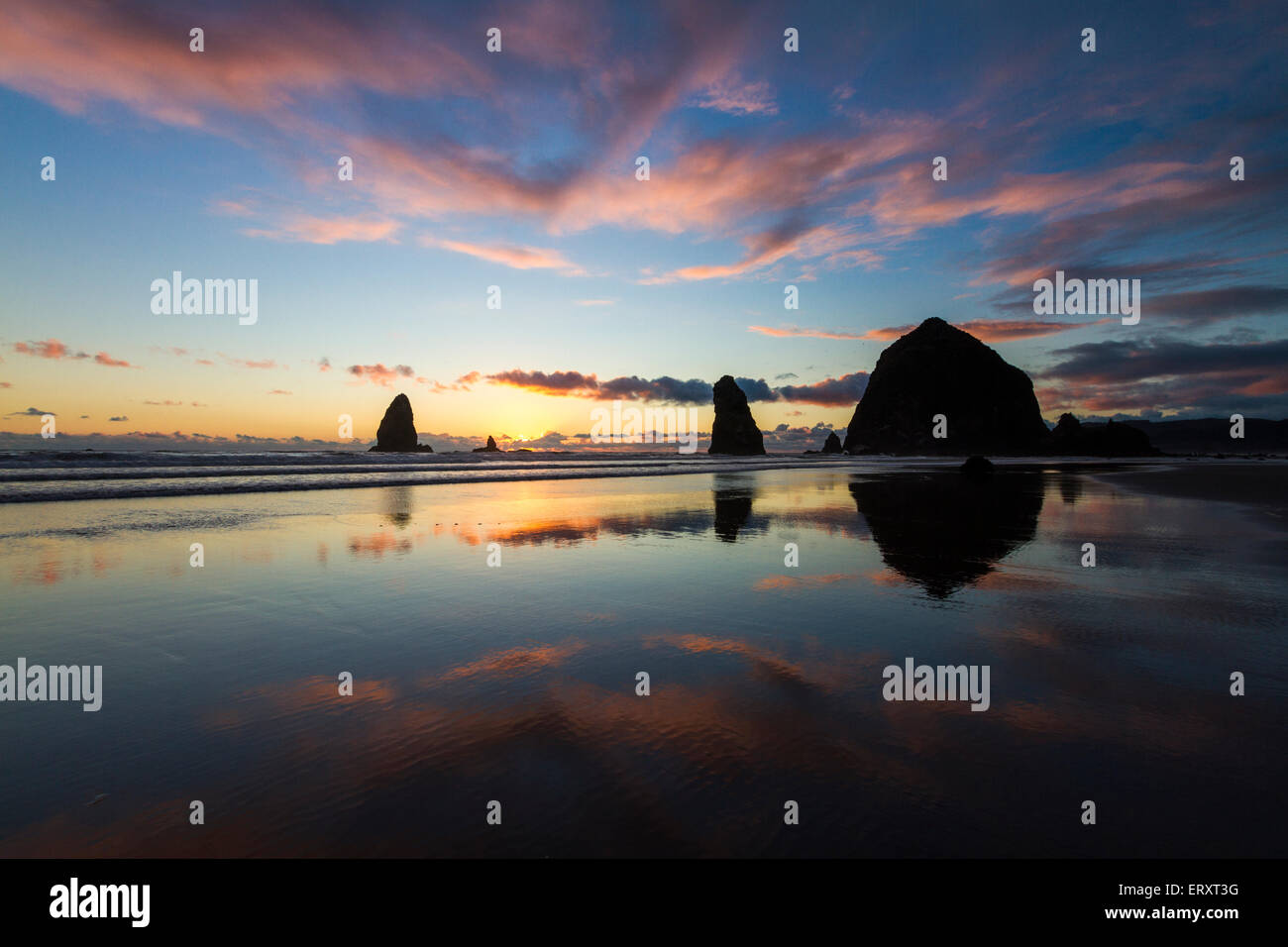 Sunset reflections at Cannon Beach, Oregon Stock Photo - Alamy