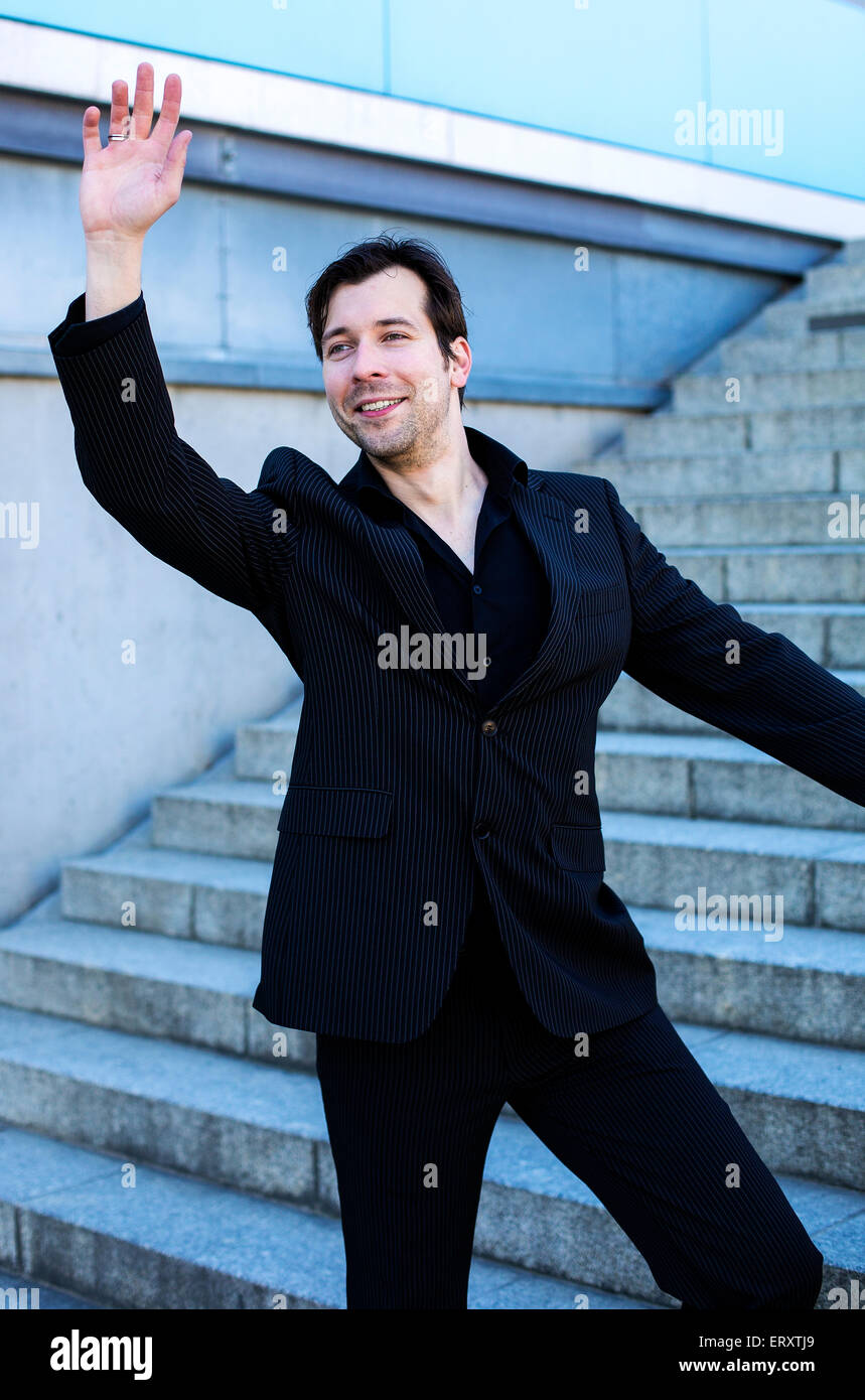 businessman standing outside on stairs and greeting someone Stock Photo ...