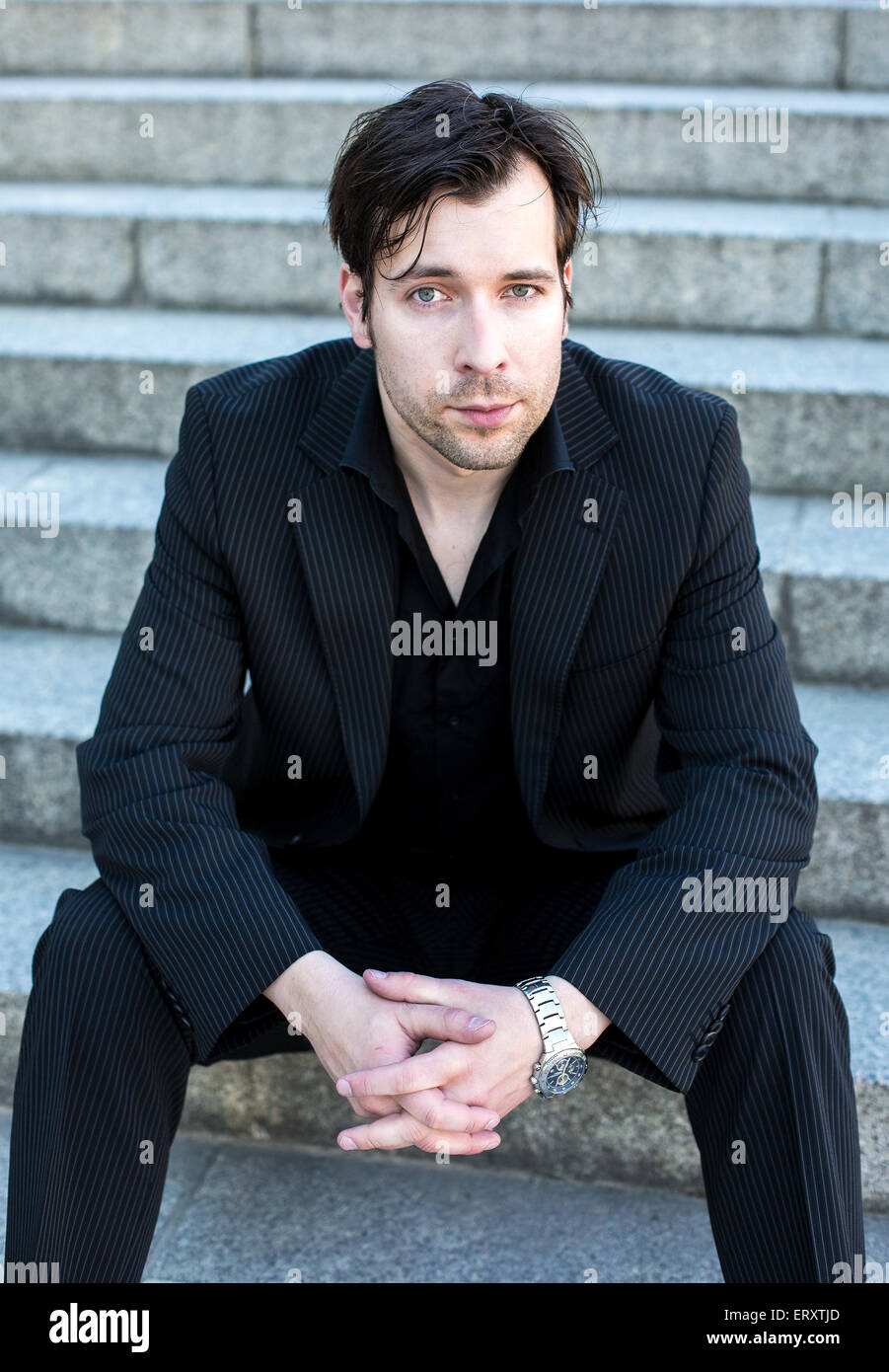 Man sitting alone on stairs hi-res stock photography and images - Alamy
