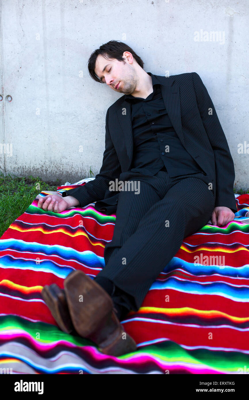 businessman passed out on a blanket outdoors Stock Photo - Alamy