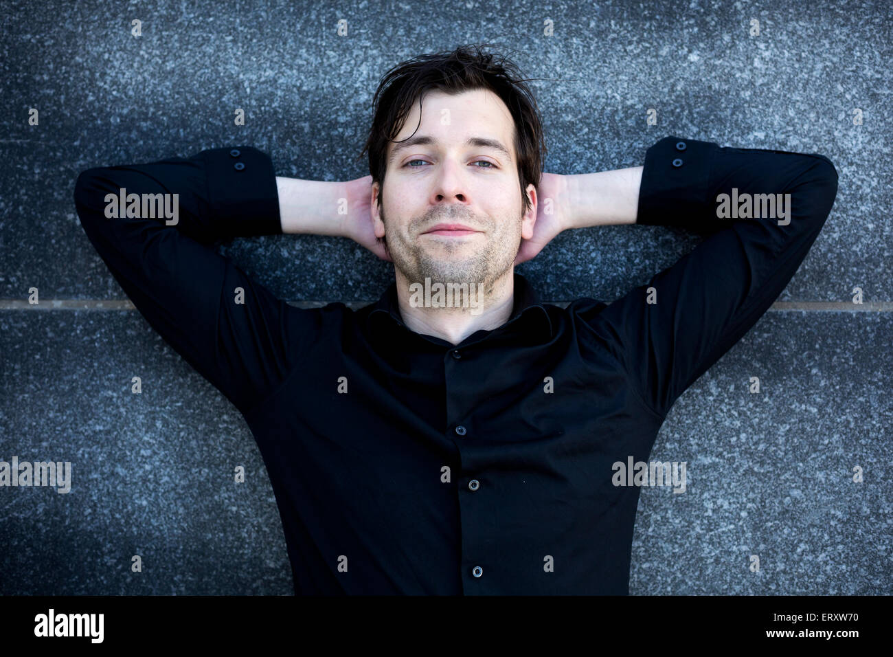 portrait of a man resting and smiling Stock Photo - Alamy