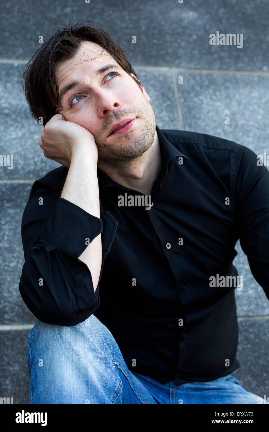 man looking thoughtfully up into the sky Stock Photo - Alamy