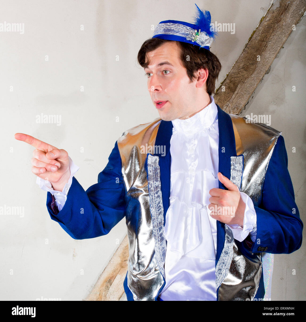 man dressed as a prince with a blue hat Stock Photo - Alamy
