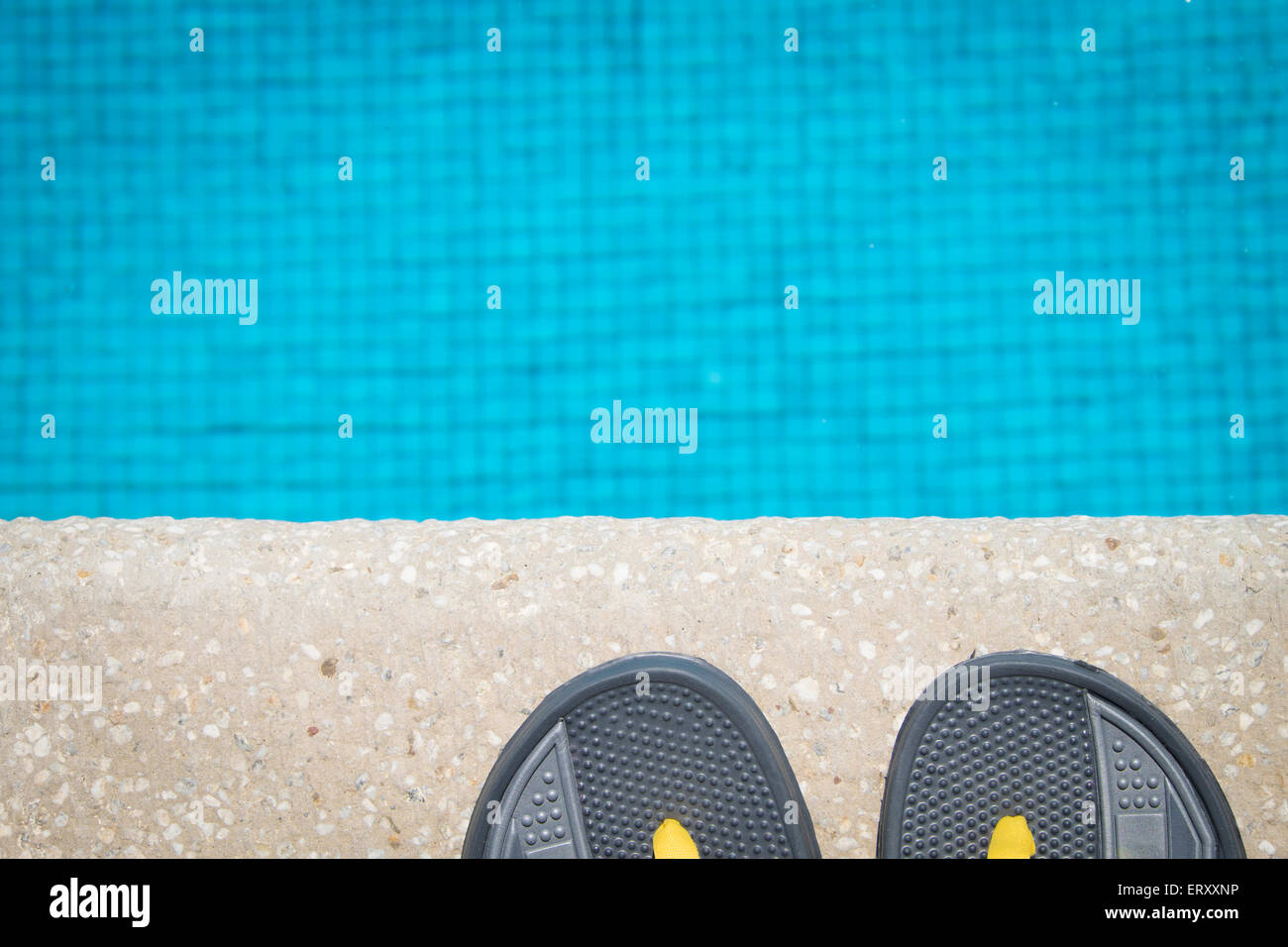 Flipflop sandals at edge of swimming pool Stock Photo - Alamy