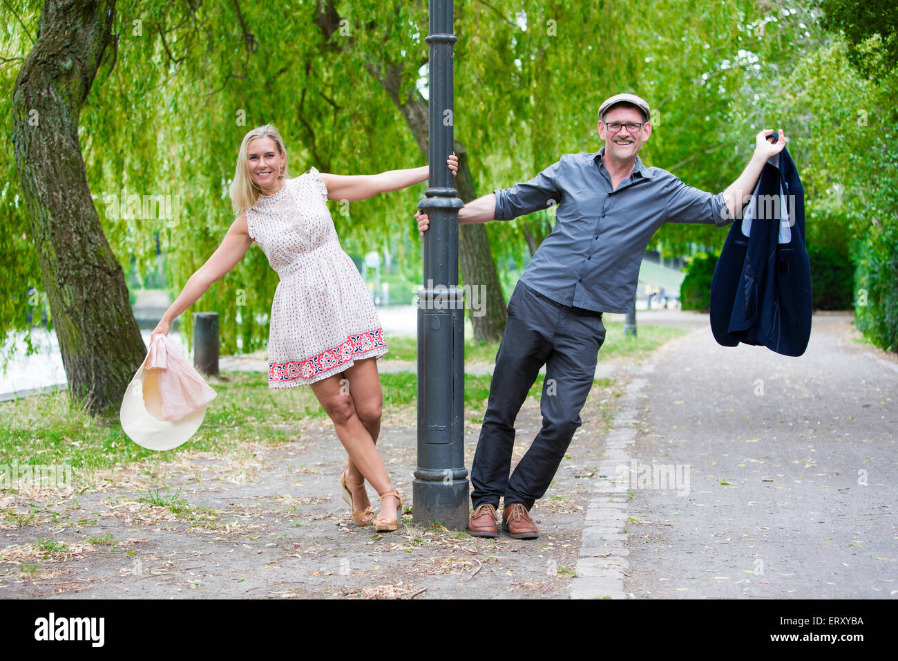 Woman holding onto man hi-res stock photography and images - Alamy