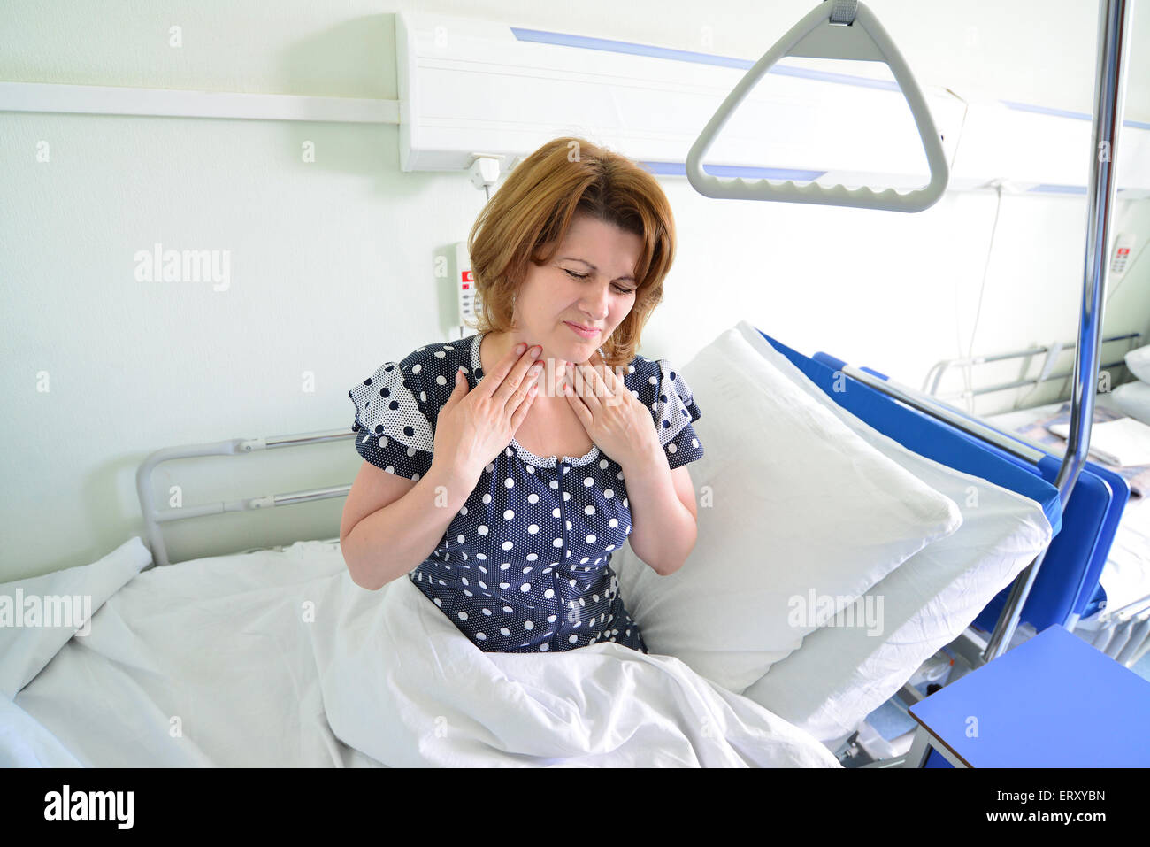 Female patient with angina on a bed in hospital ward Stock Photo - Alamy