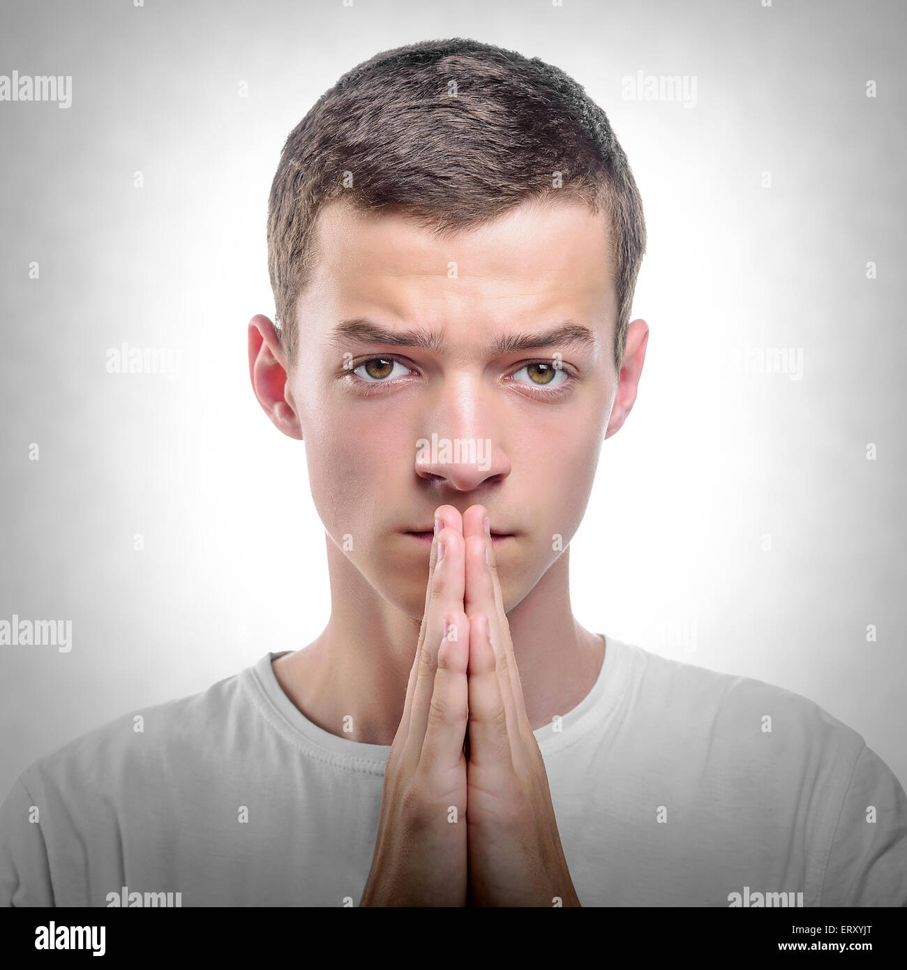 Young man praying or thinking Stock Photo - Alamy