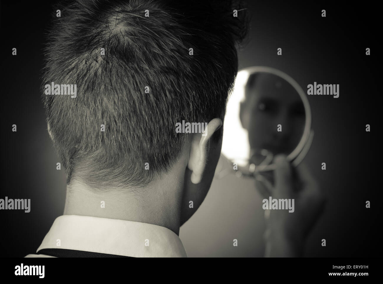 business man looking in the mirror and reflecting Stock Photo - Alamy