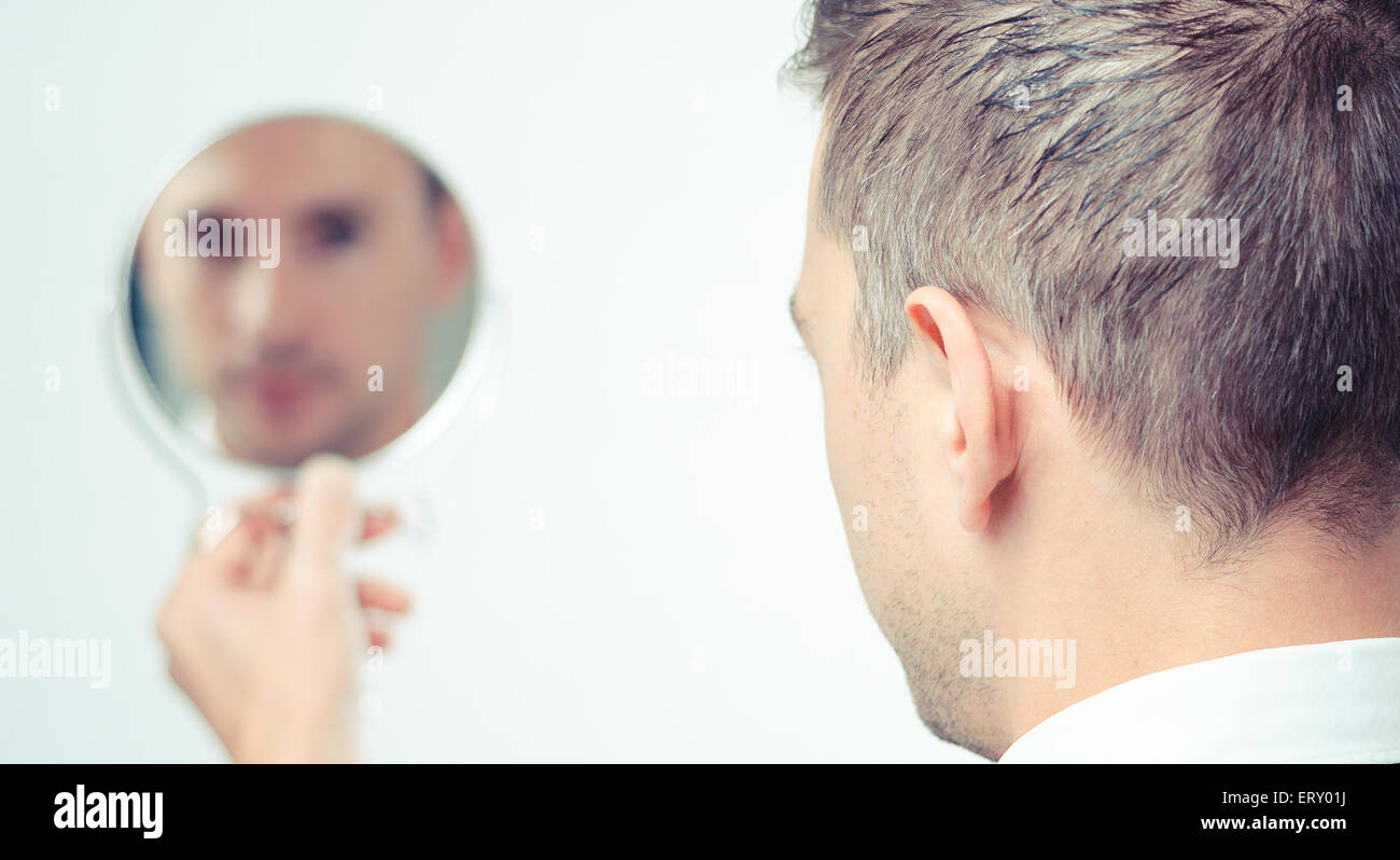 business man looking in the mirror and reflecting Stock Photo - Alamy