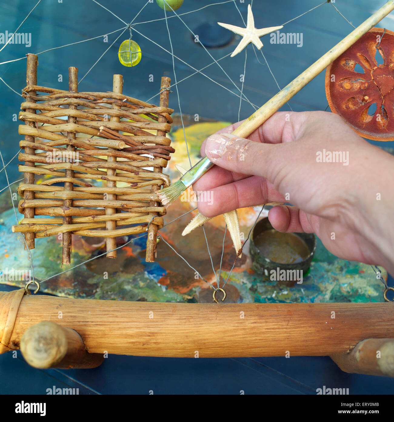 Artist hand painting Stock Photo - Alamy