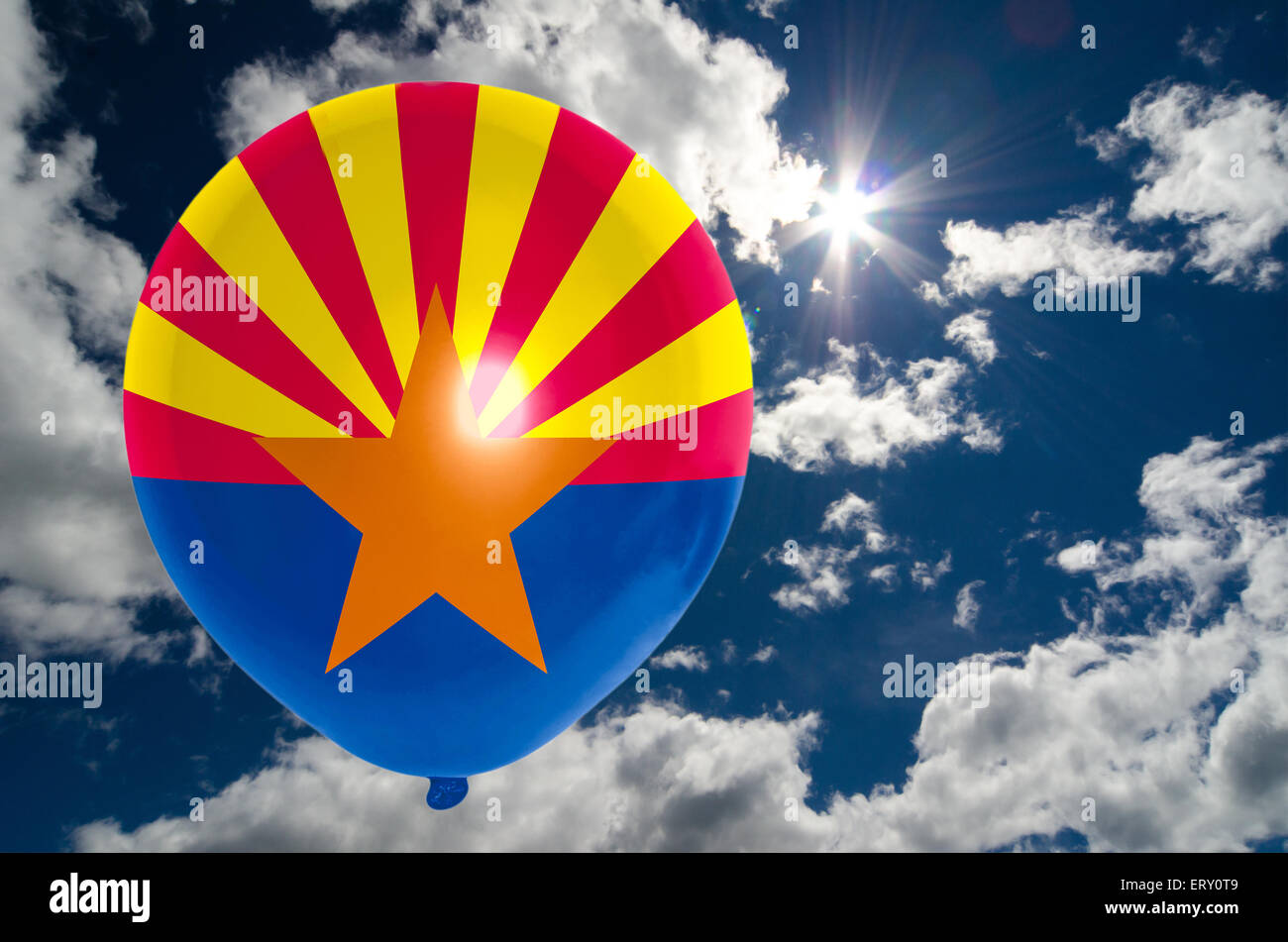 balloon in colors of arizona flag flying on blue sky Stock Photo - Alamy