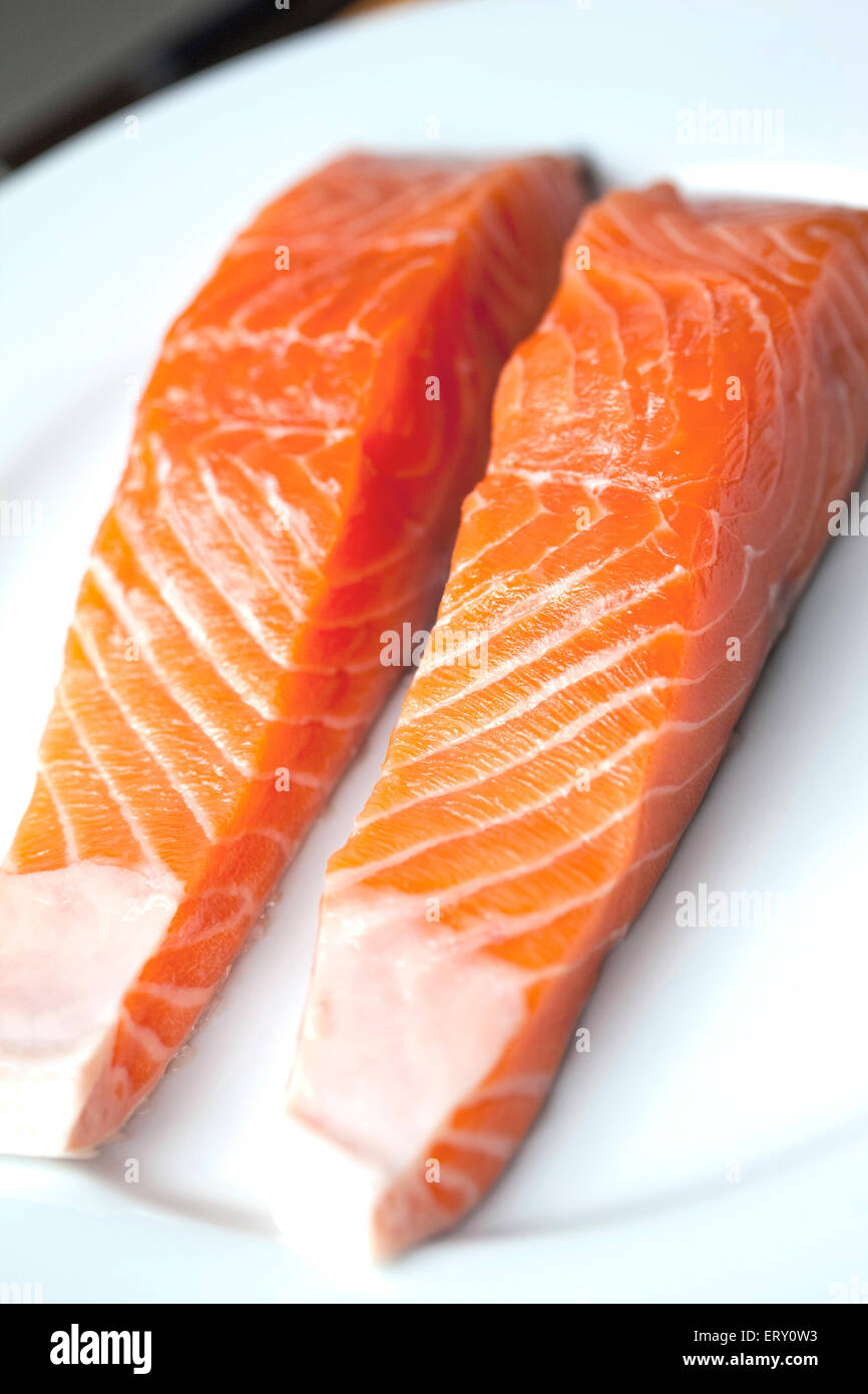 Close up of two Salmon fillets on a table Stock Photo - Alamy