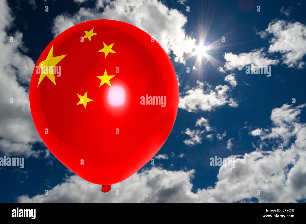 balloon in colors of china flag flying on blue sky Stock Photo - Alamy