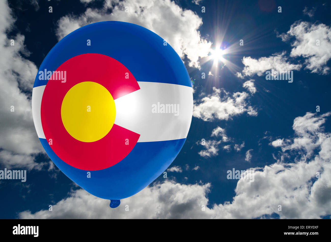 balloon in colors of colorado flag flying on blue sky Stock Photo - Alamy