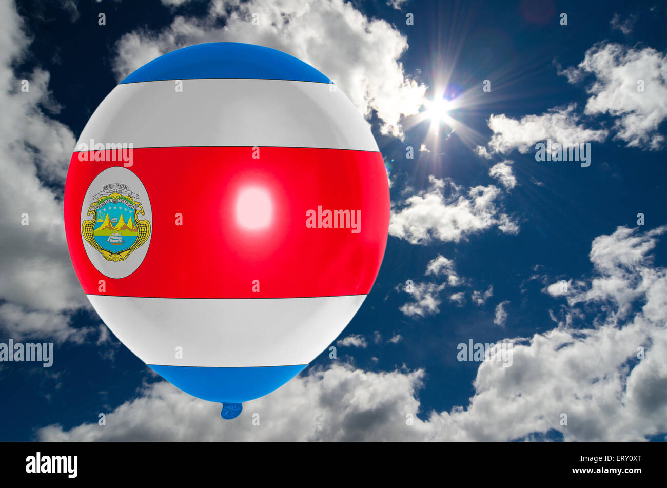 balloon in colors of costarica flag flying on blue sky Stock Photo - Alamy