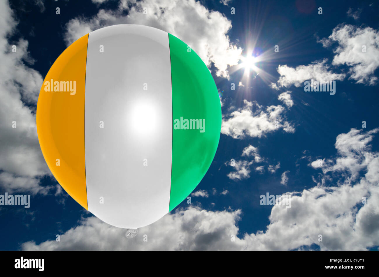 balloon in colors of ivory coast flag flying on blue sky Stock Photo ...