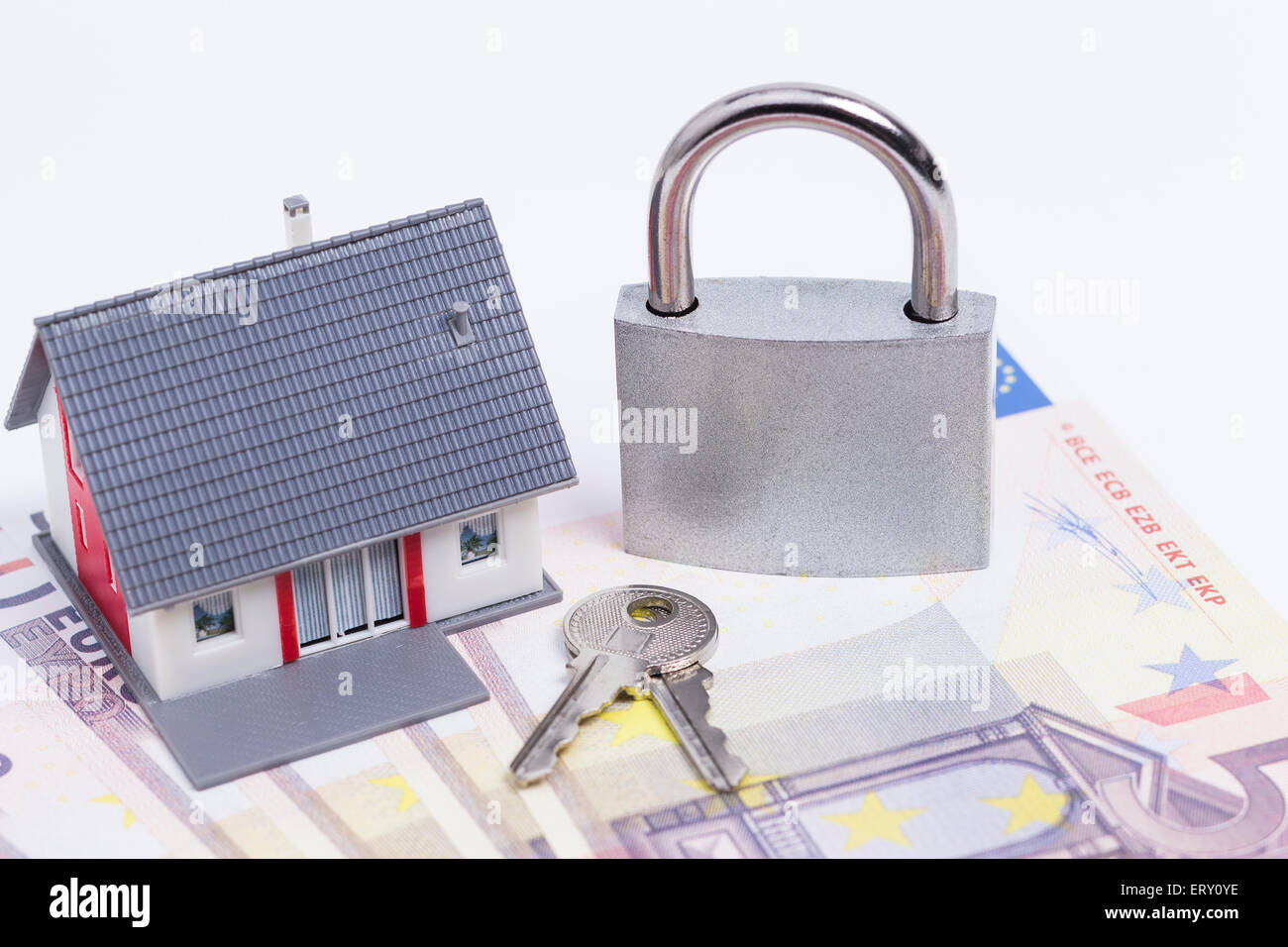 Image shows a miniature house with an open padlock Stock Photo - Alamy