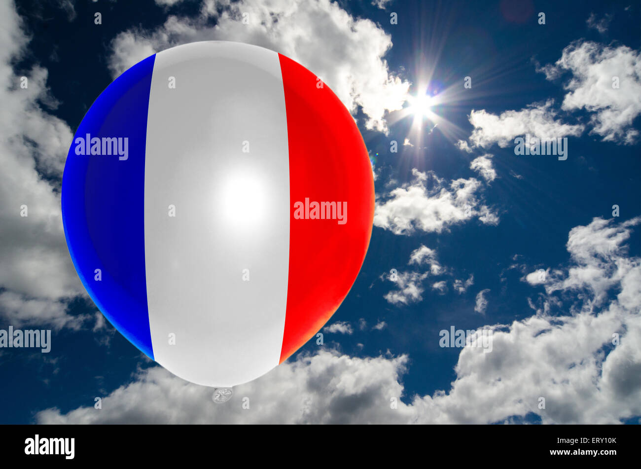 balloon in colors of france flag flying on blue sky Stock Photo - Alamy