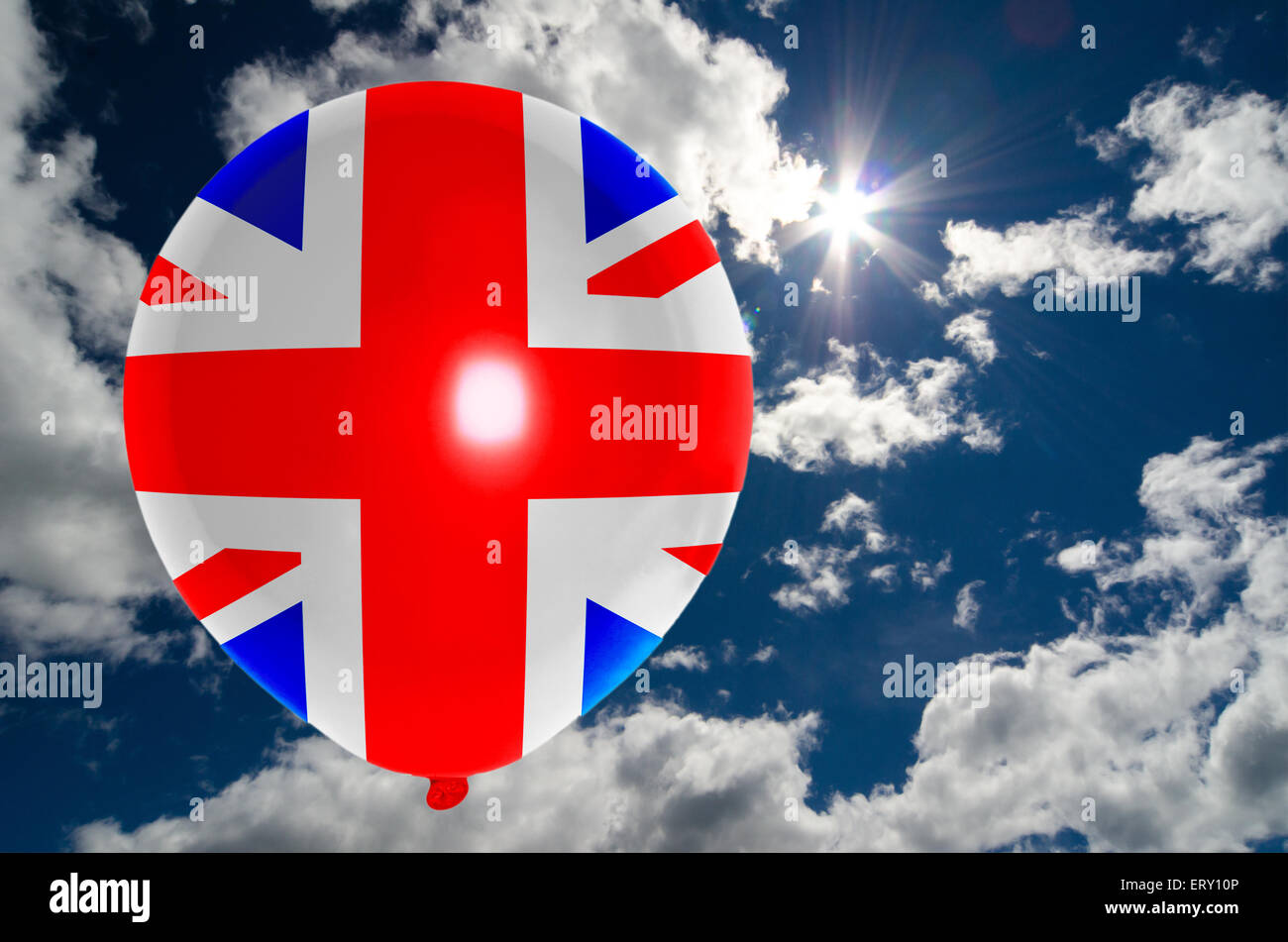 balloon in colors of united kingdom flag flying on blue sky Stock Photo ...