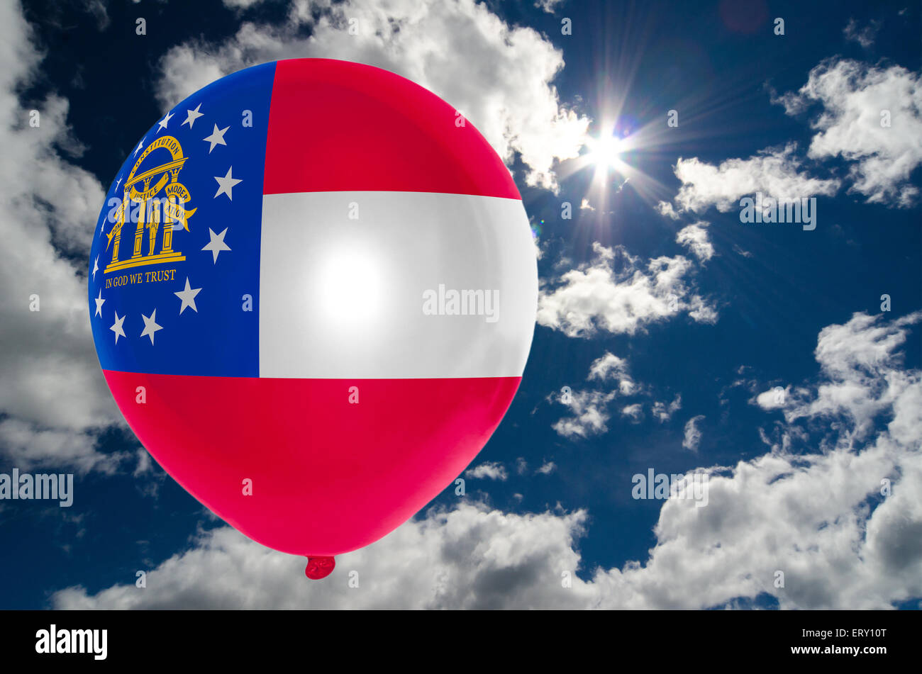 balloon in colors of georgia flag flying on blue sky Stock Photo - Alamy