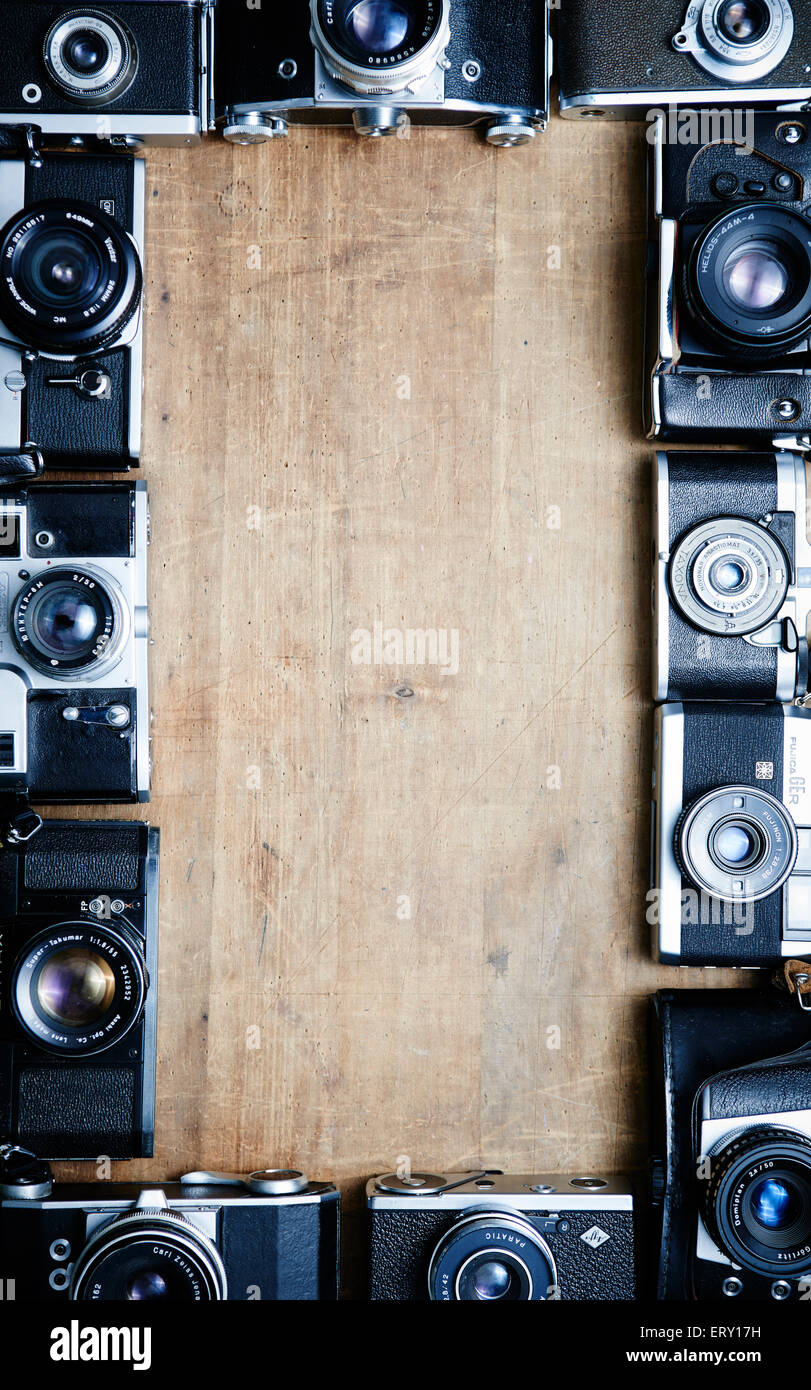 Old retro film analogue cameras collection on vintage wooden desk ...