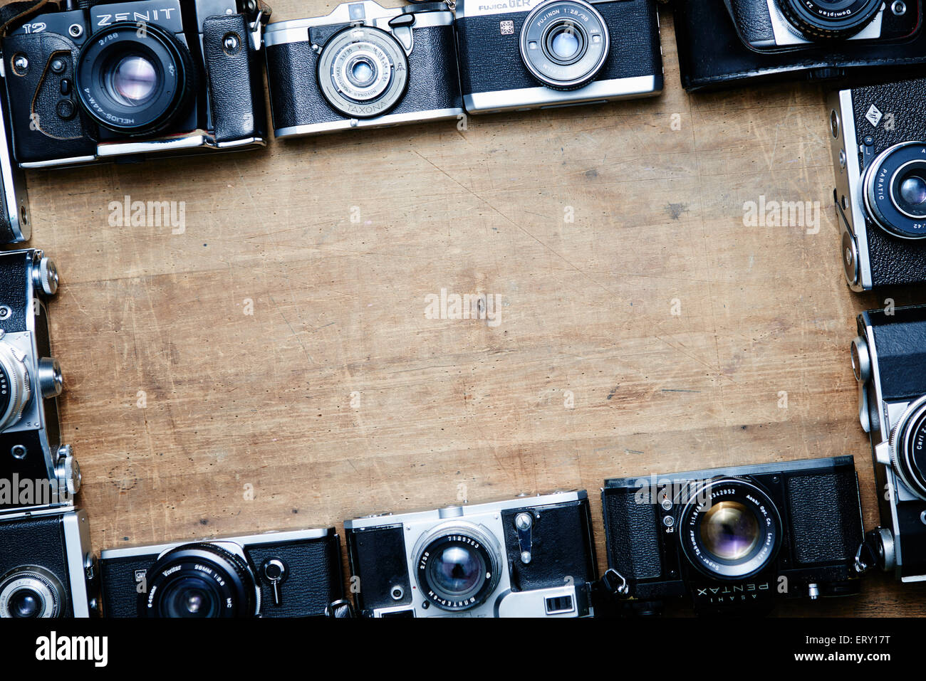 Old retro film analogue cameras collection on vintage wooden desk ...