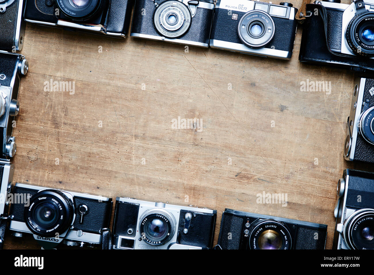 Old retro film analogue cameras collection on vintage wooden desk ...