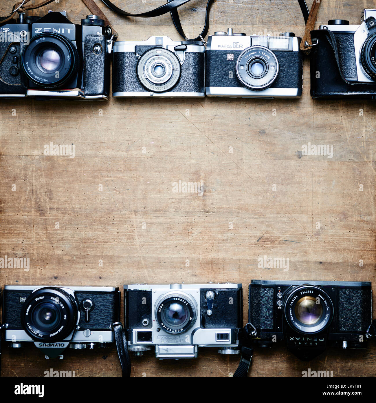 Old retro film analogue cameras collection on vintage wooden desk ...