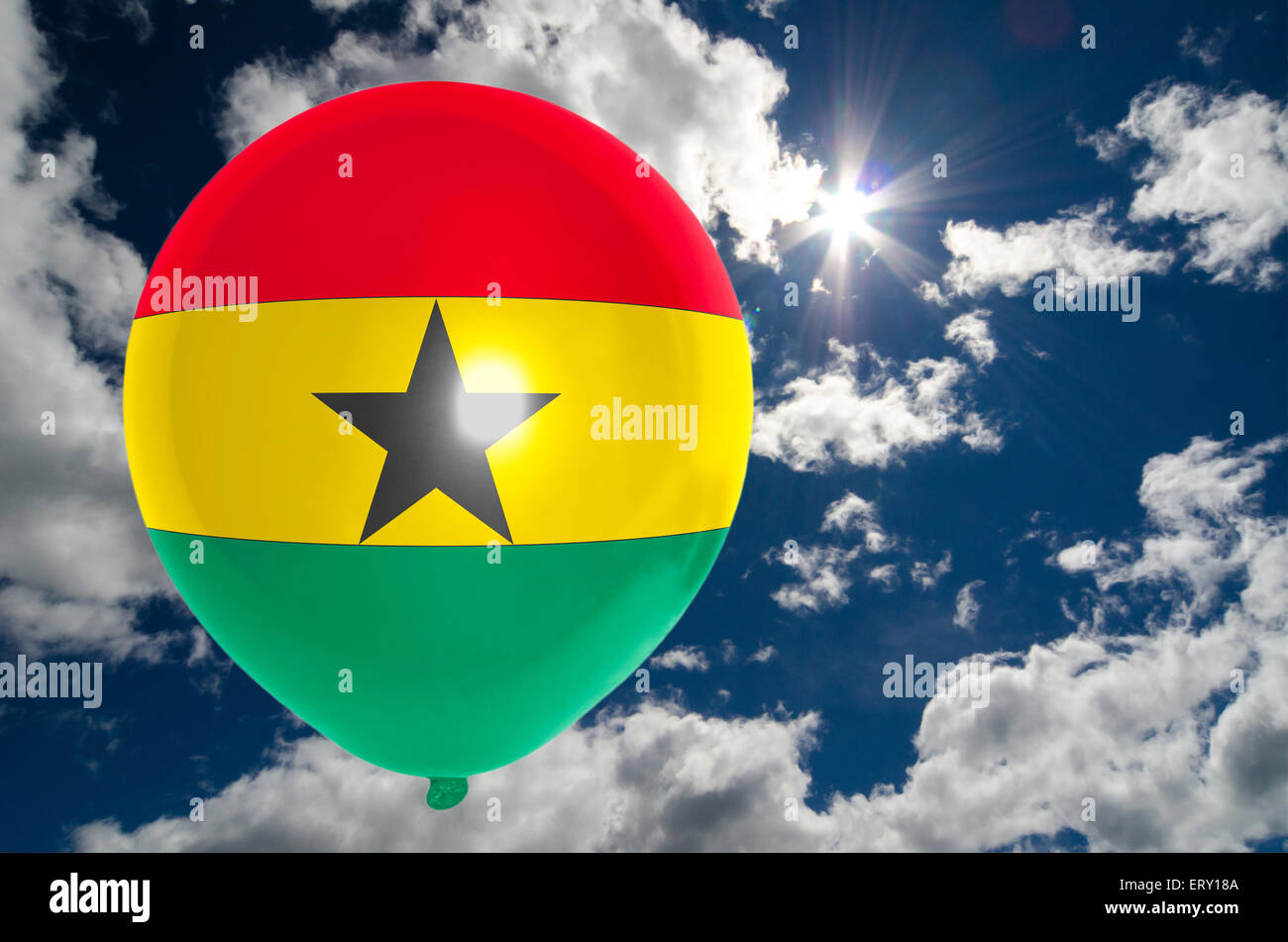 balloon in colors of ghana flag flying on blue sky Stock Photo - Alamy